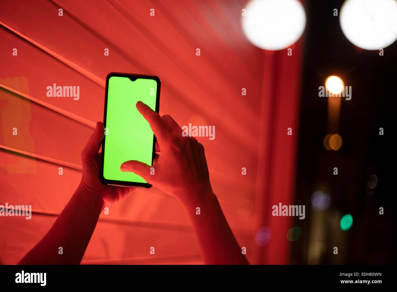 hand holding cell phone with camera screen and night illumination Stock ...
