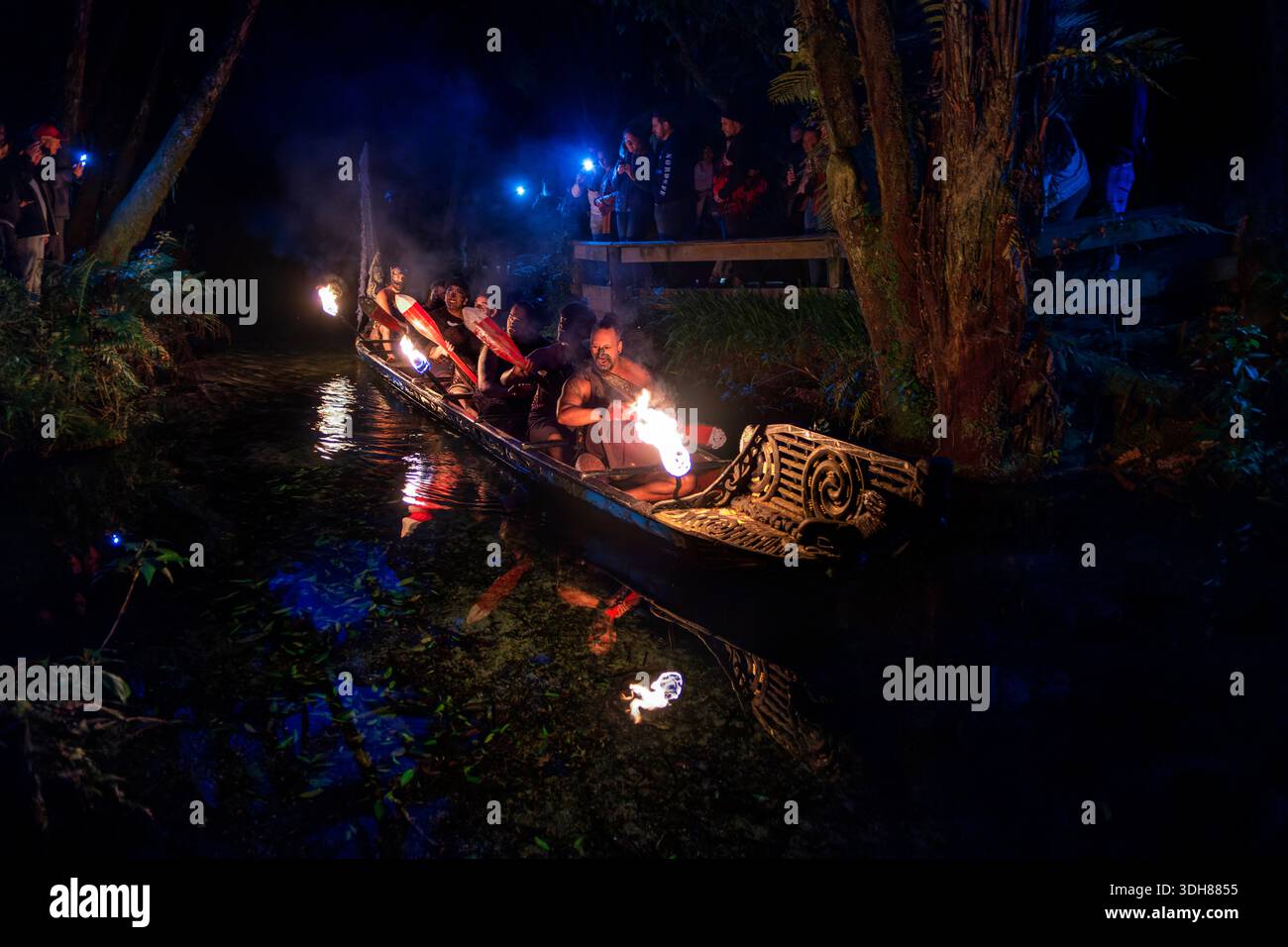 Maori canoe show performance to the audience in Mitai Maori village ...