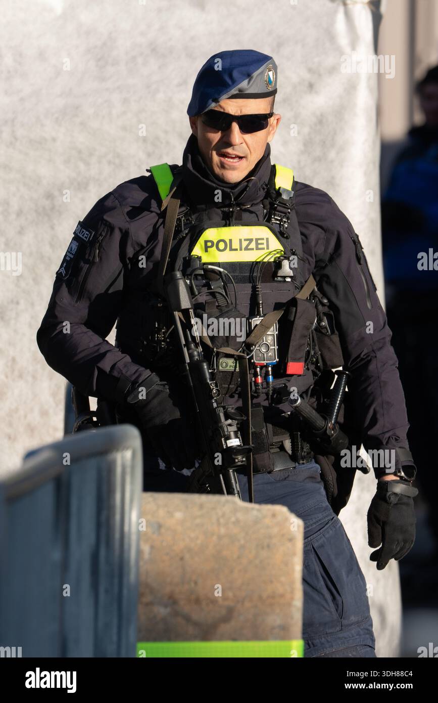 Police officer wearing tactical gear and uniform, ensuring safety and ...