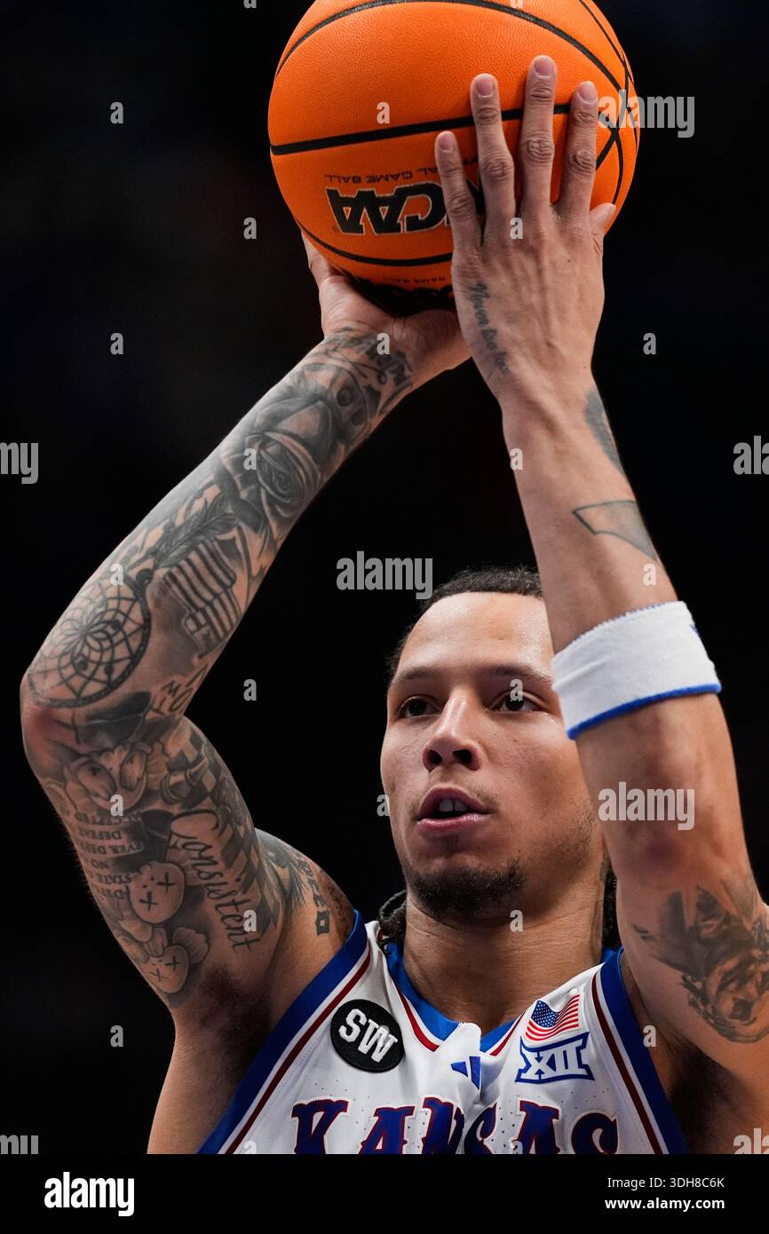 Kansas guard Tre White shoots during the first half of an NCAA college ...