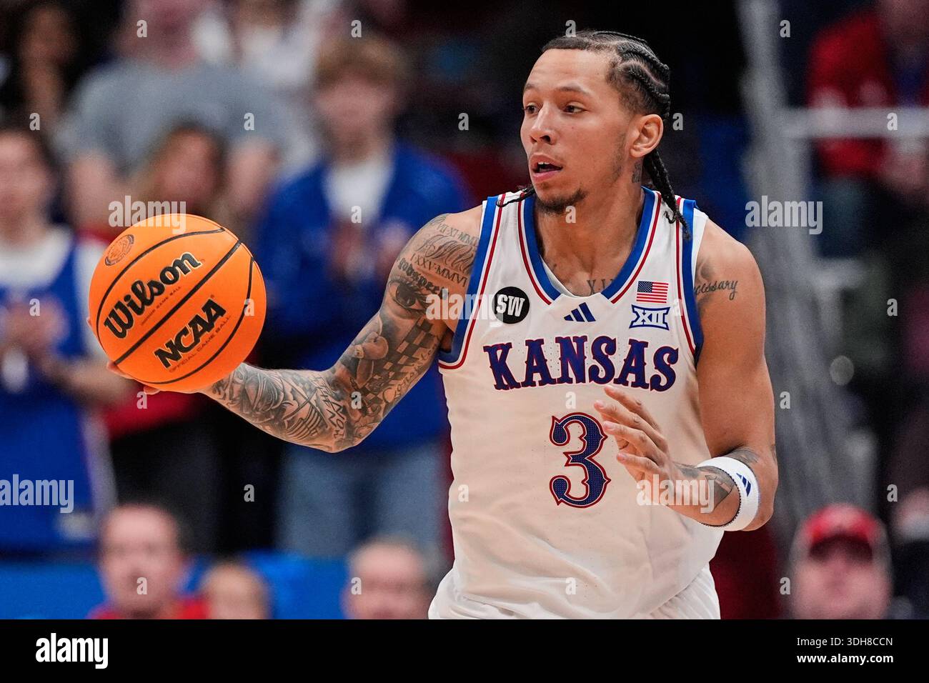 Kansas guard Tre White drives during the first half of an NCAA college ...