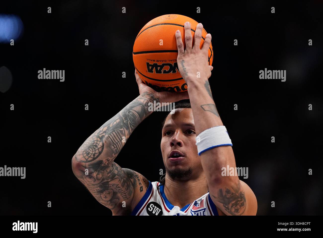 Kansas guard Tre White shoots during the first half of an NCAA college ...
