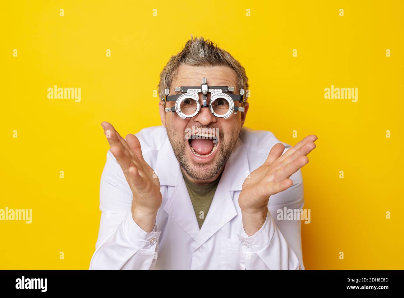 Funny male eye doctor wearing trial frame with surprised reaction for ...
