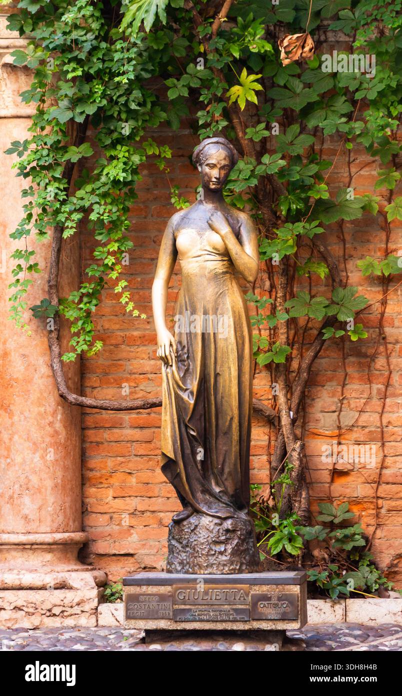 Verona, Italy - April 2025: Juliet statue in front of the Romeo and ...