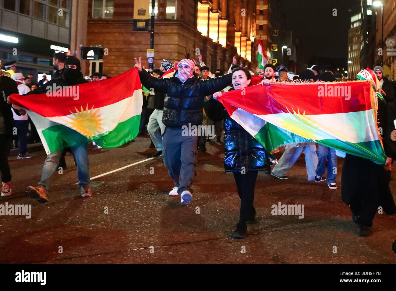 Manchester, United Kingdom. Pro-Kurd protestors march down Oxford Road ...