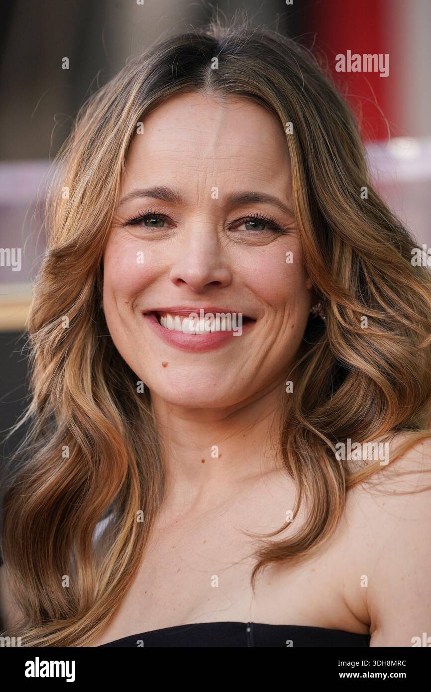Rachel McAdams poses with her new star during a ceremony on the ...