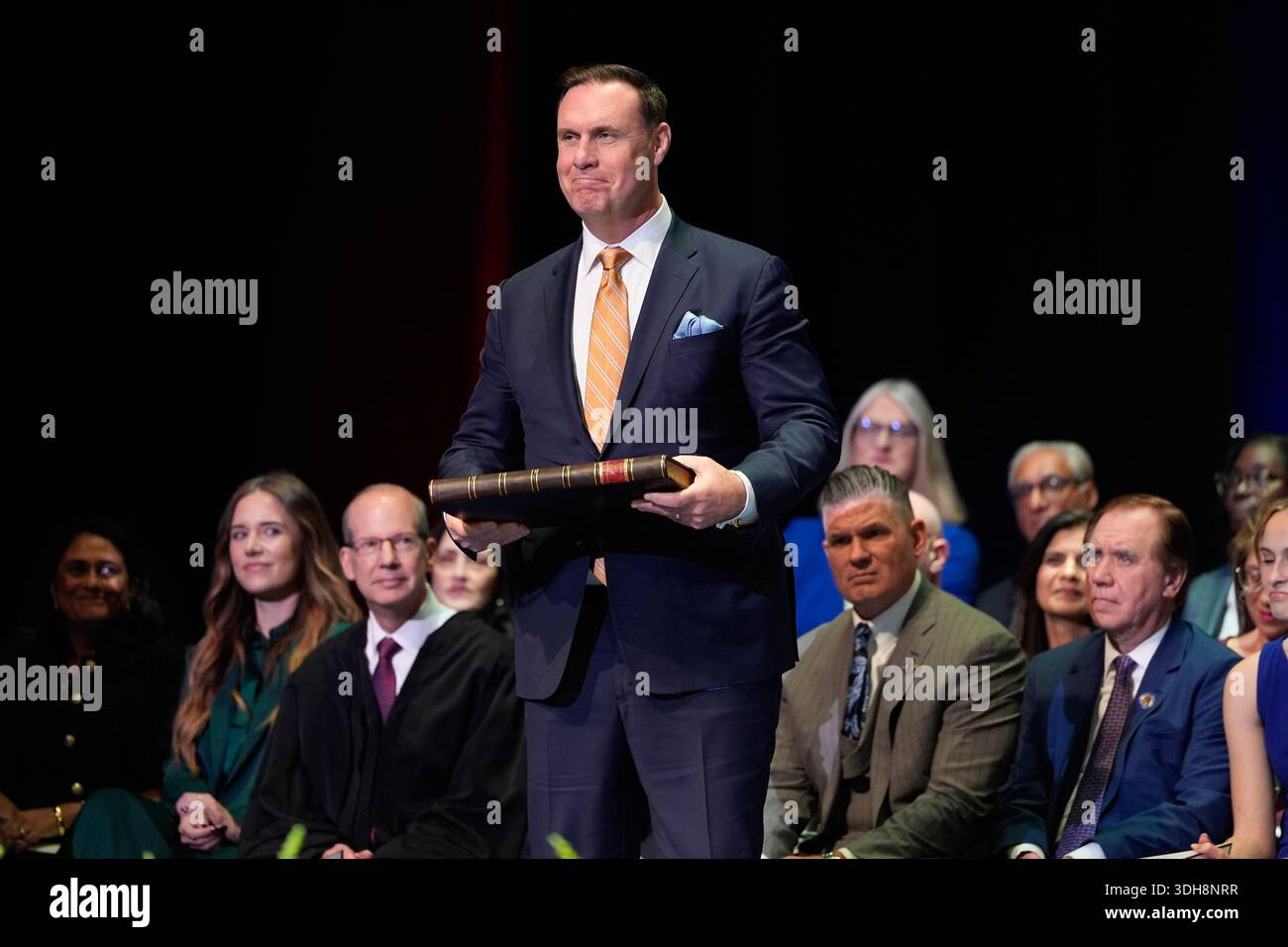 Jason Hedberg stands during the inauguration ceremony for his wife New ...