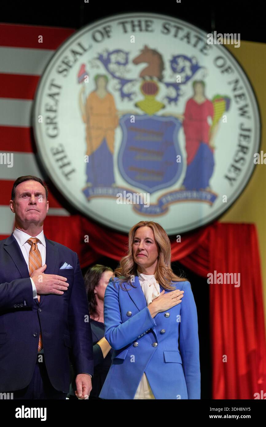 New Jersey Governor Mikie Sherrill and her husband Jason Hedberg stand ...