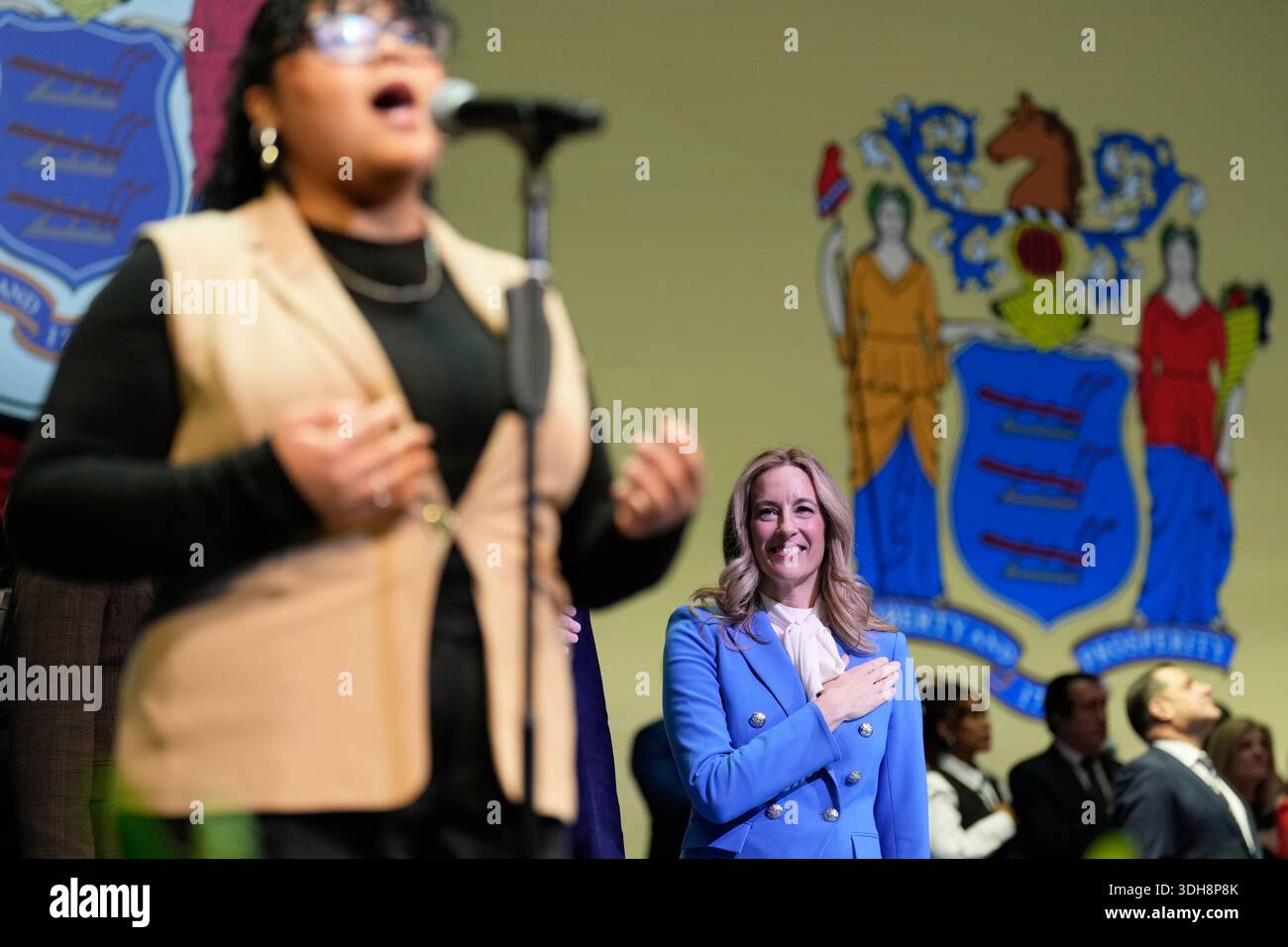 New Jersey Governor Mikie Sherrill stands for the national anthem ...