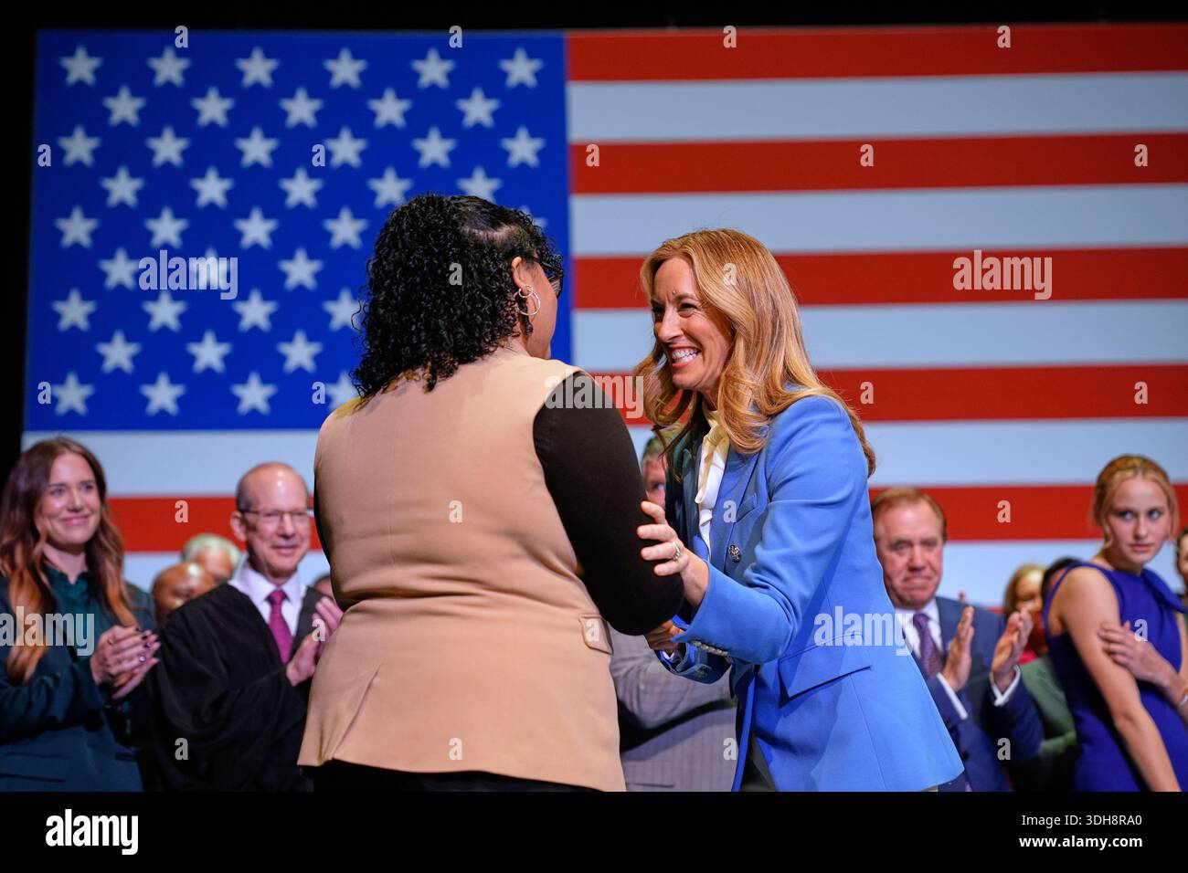 New Jersey Governor Mikie Sherrill greets Genesis Rincon after she sang ...
