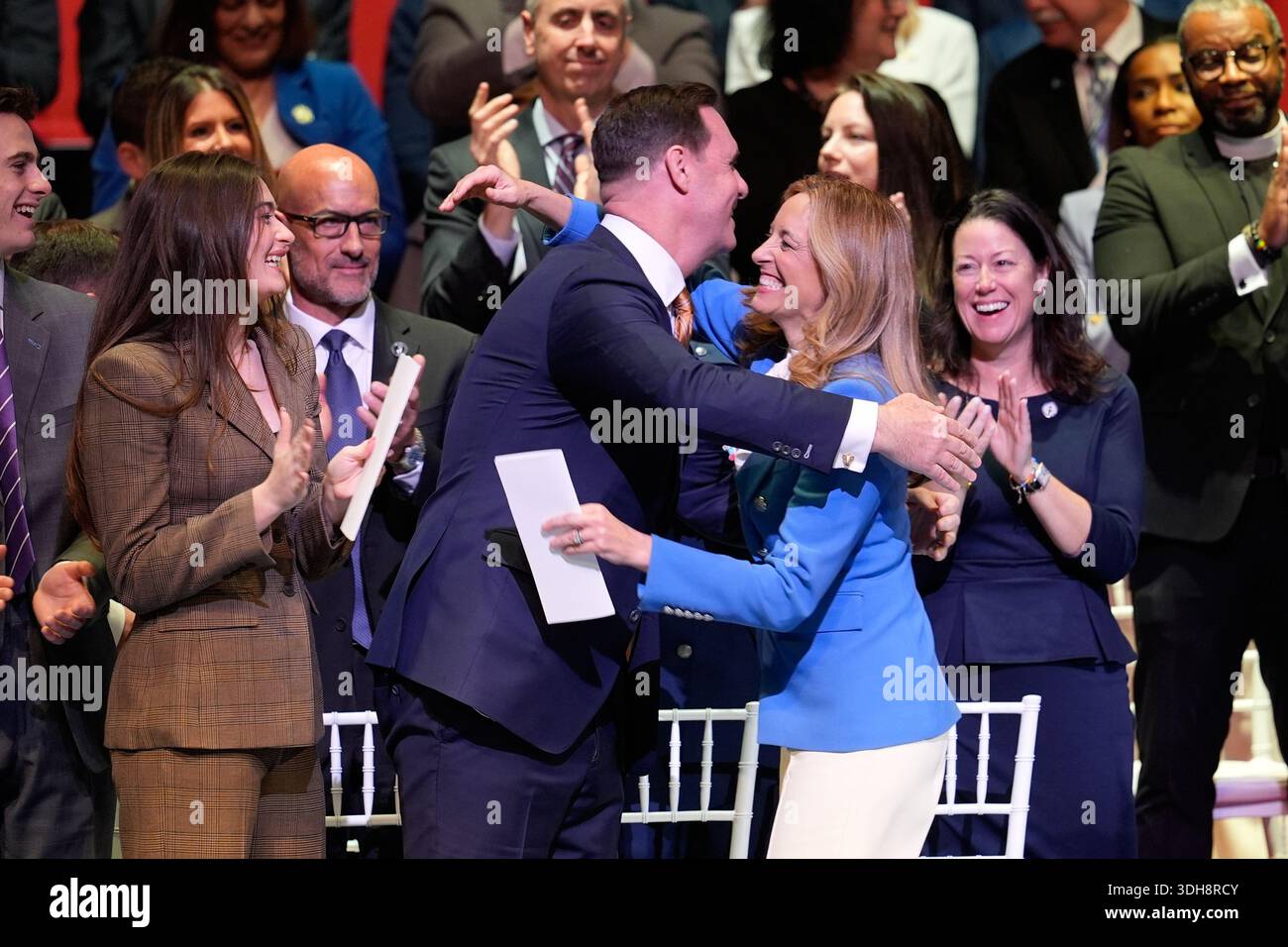 New Jersey Governor Mikie Sherrill hugs her husband Jason Hedberg ...