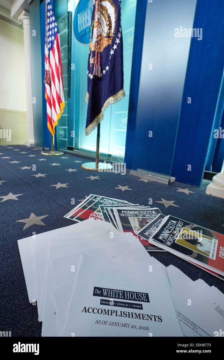 Documents lie on the briefing room floor after a press conference with ...