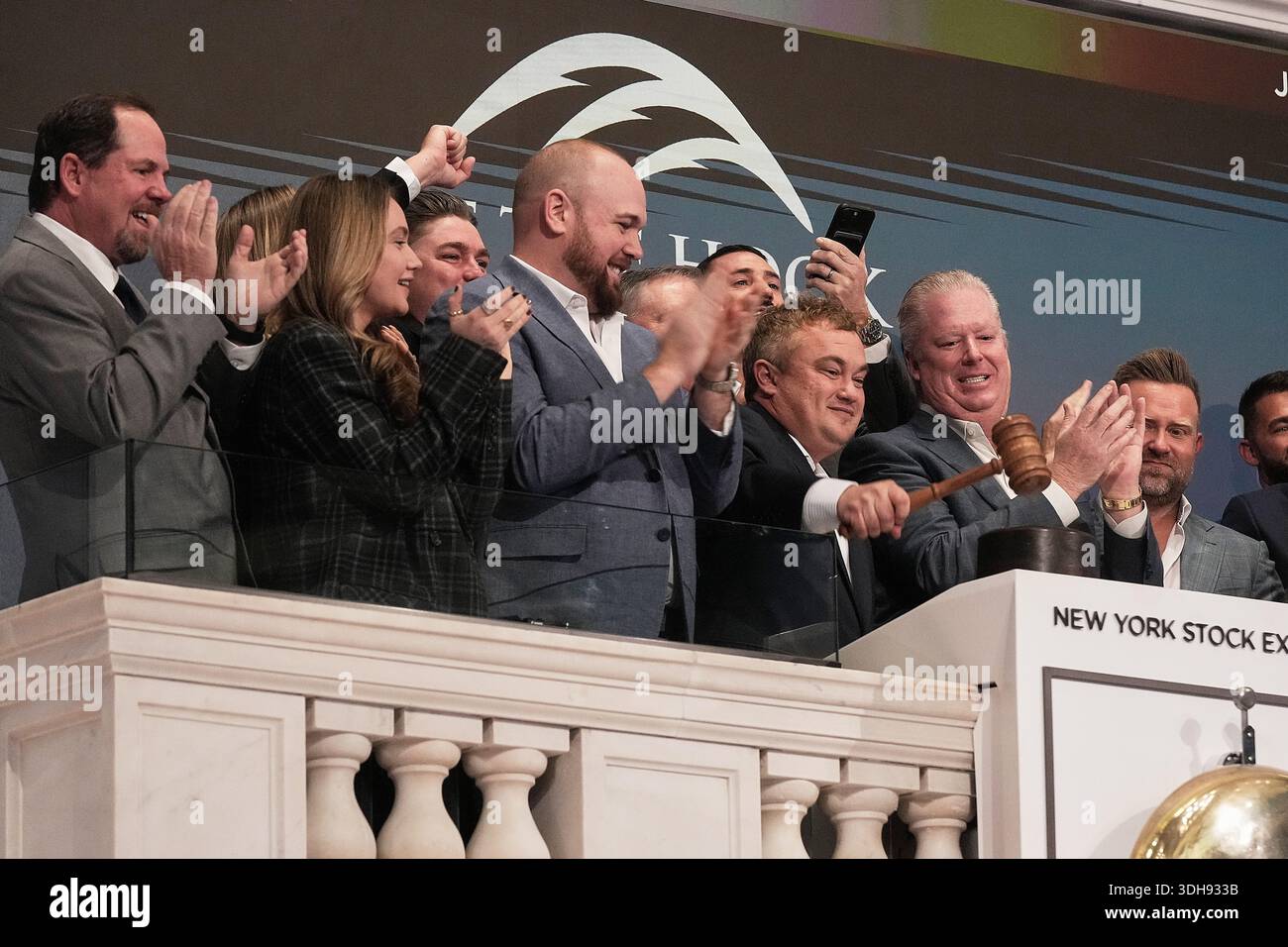 Off The Hook Yachts President Jason Ruegg gavels trading closed at the ...