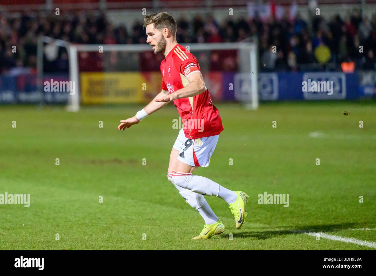 Luke Garbutt of Salford City FC celebrates scoring his side's third ...