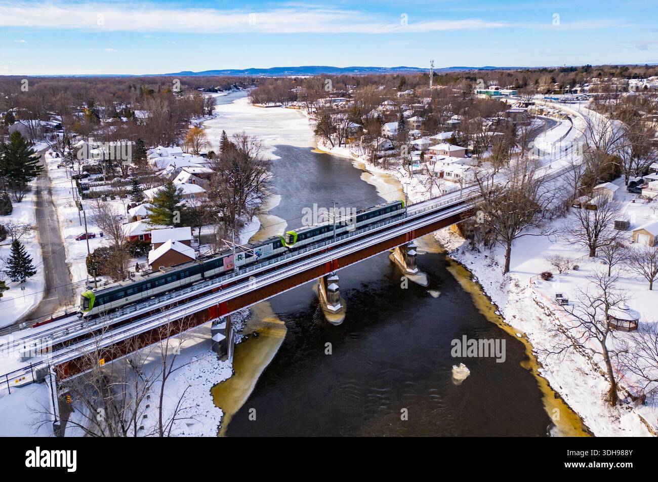 An aerial view of the REM train travelling from Ile Bigras on the Deux ...