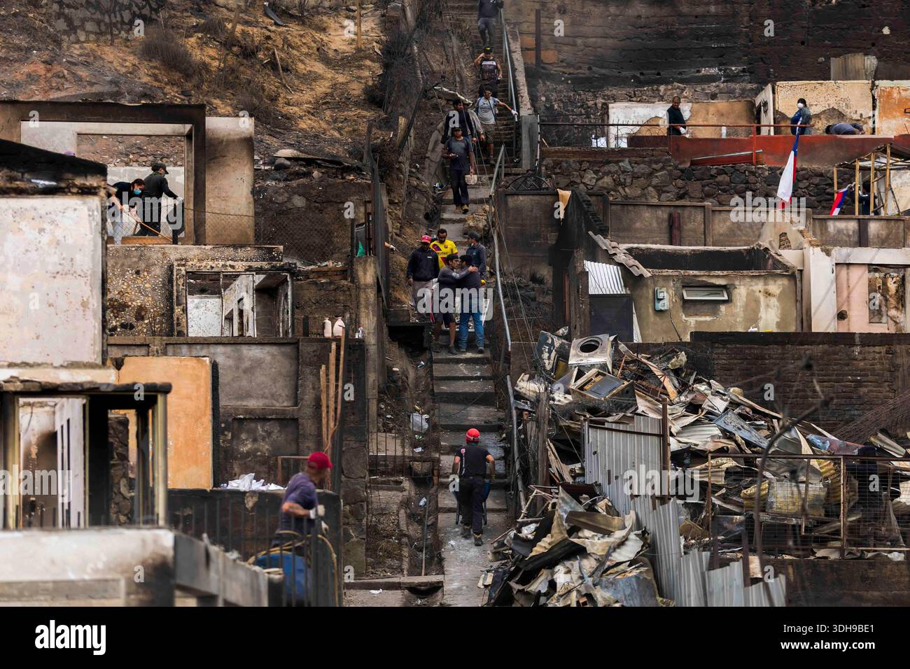 People salvage belongings from their homes that were damaged by ...