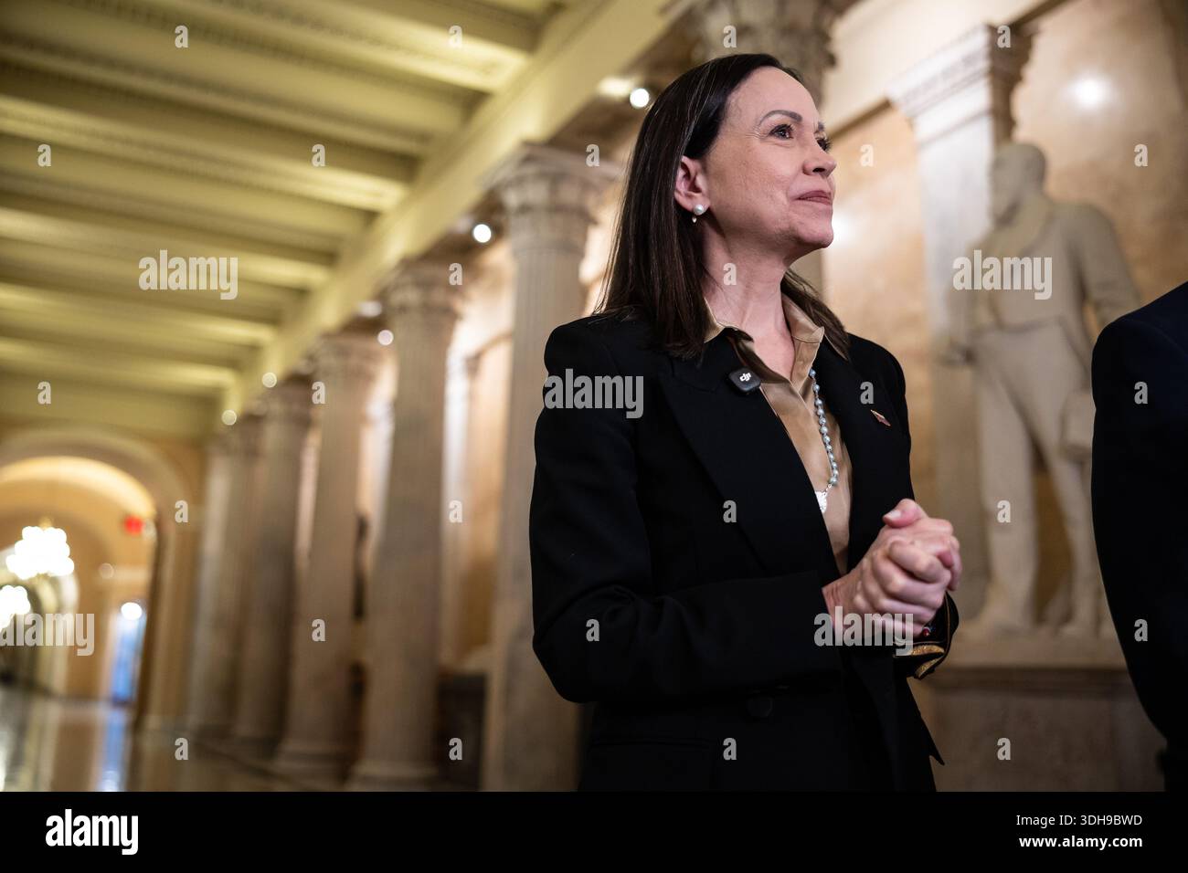 Venezuelan opposition leader María Corina Machado speaks with reporters ...