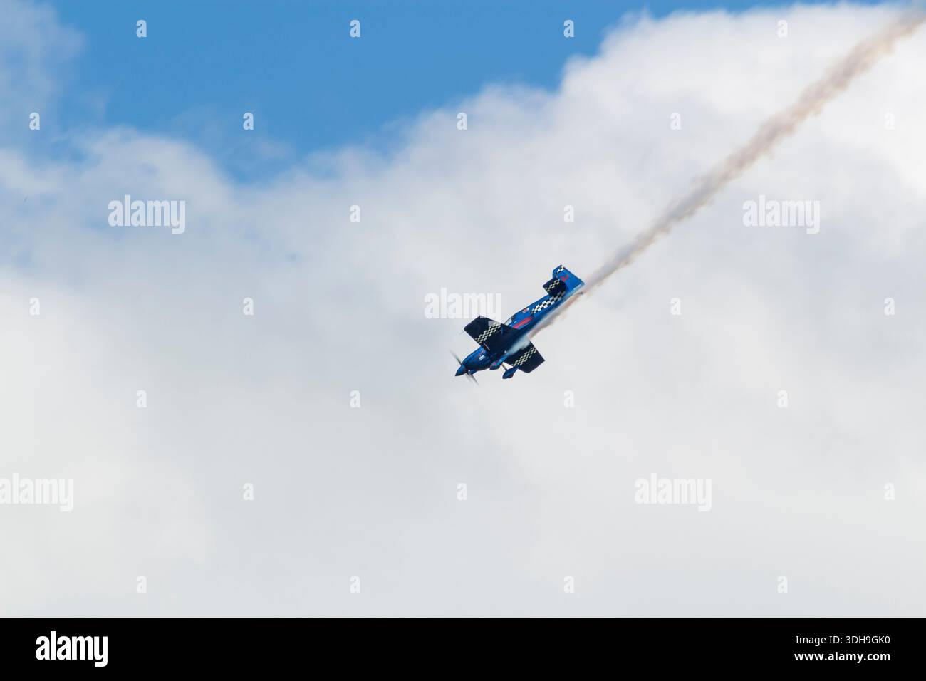 MX Aircraft MXS aerobatic plane in blue/red livery with smoke trail ...