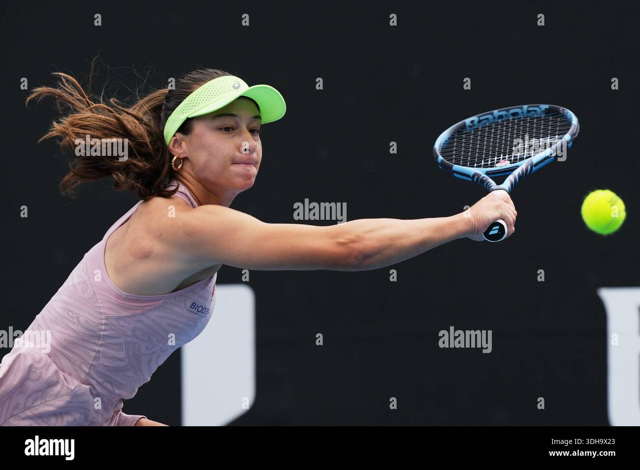 Zeynep Sonmez of Turkey plays a backhand return to Anna Bondar of ...