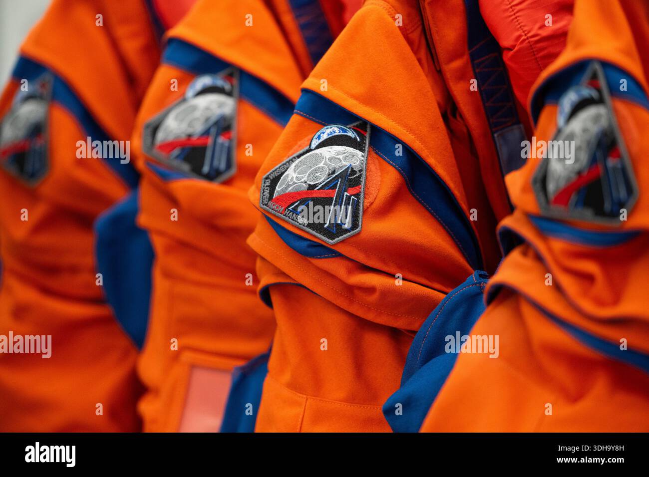 The Artemis II mission patch is seen on the right shoulder of the Orion ...