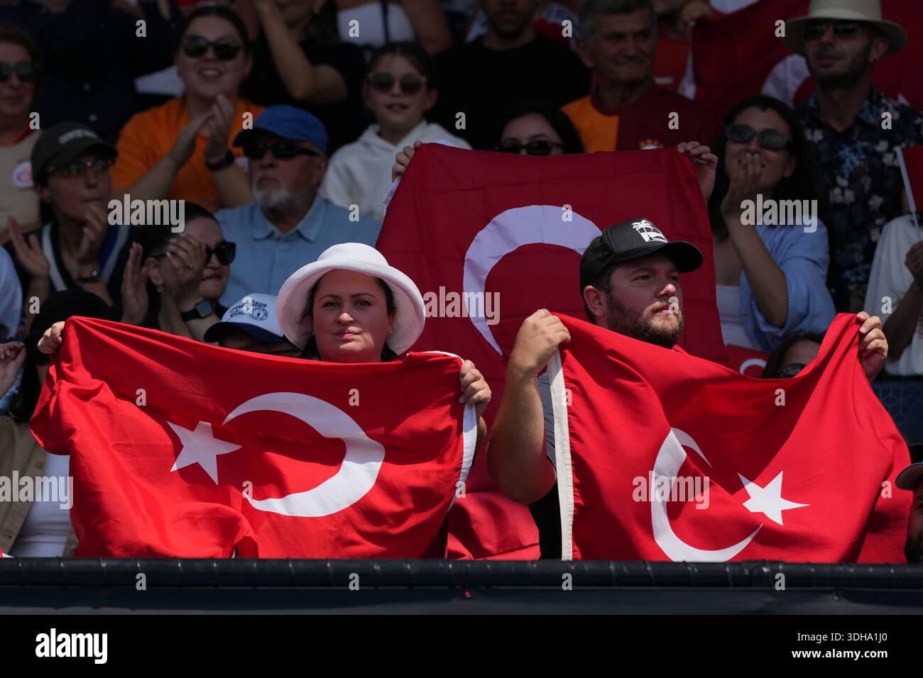Supporters of Zeynep Sonmez of Turkey react during her second round ...