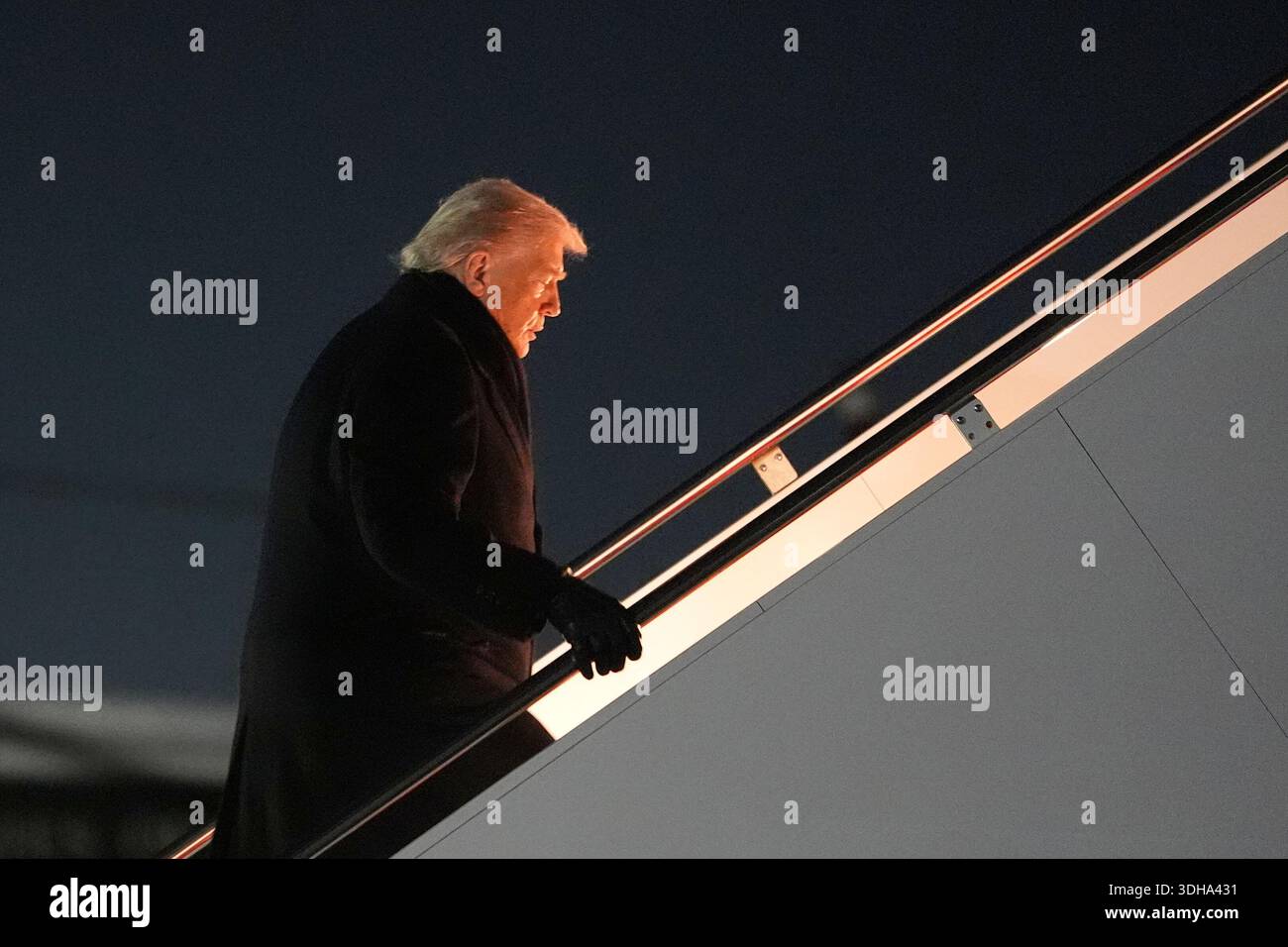 President Donald Trump boards Air Force One for a trip to attend the ...