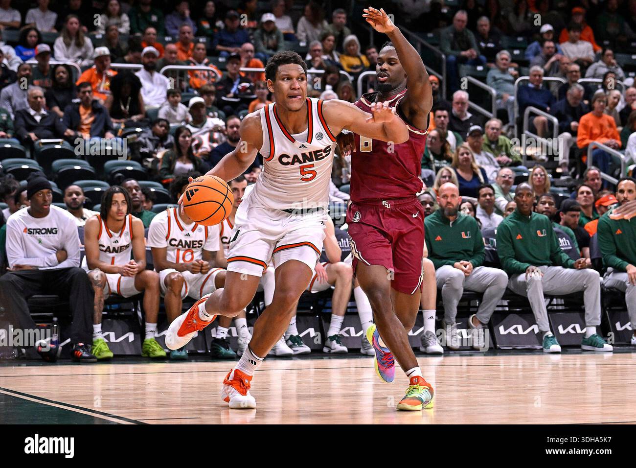 CORAL GABLES, FL - JANUARY 20: Miami forward Malik Reneau (5) drives to ...