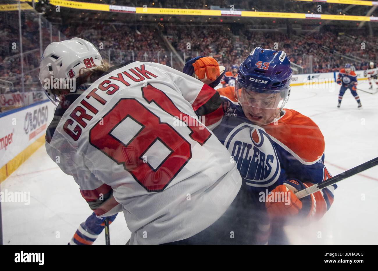 New Jersey Devils' Arseny Gritsyuk (81) is checked by Edmonton Oilers ...