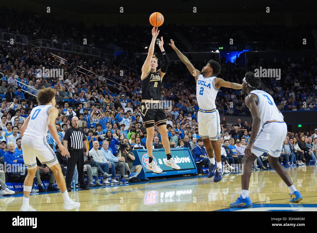 UCLA guard Donovan Dent (2) shoots under pressure by UCLA guard Donovan ...