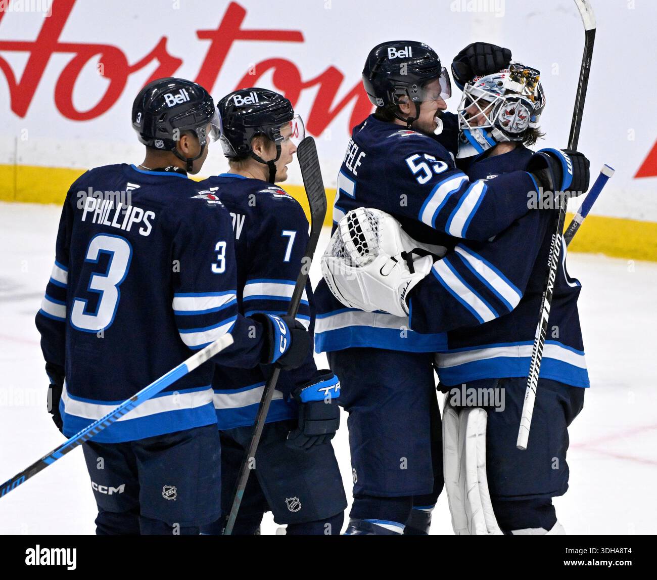 Winnipeg Jets' goaltender Eric Comrie (1) celebrates the win over the ...