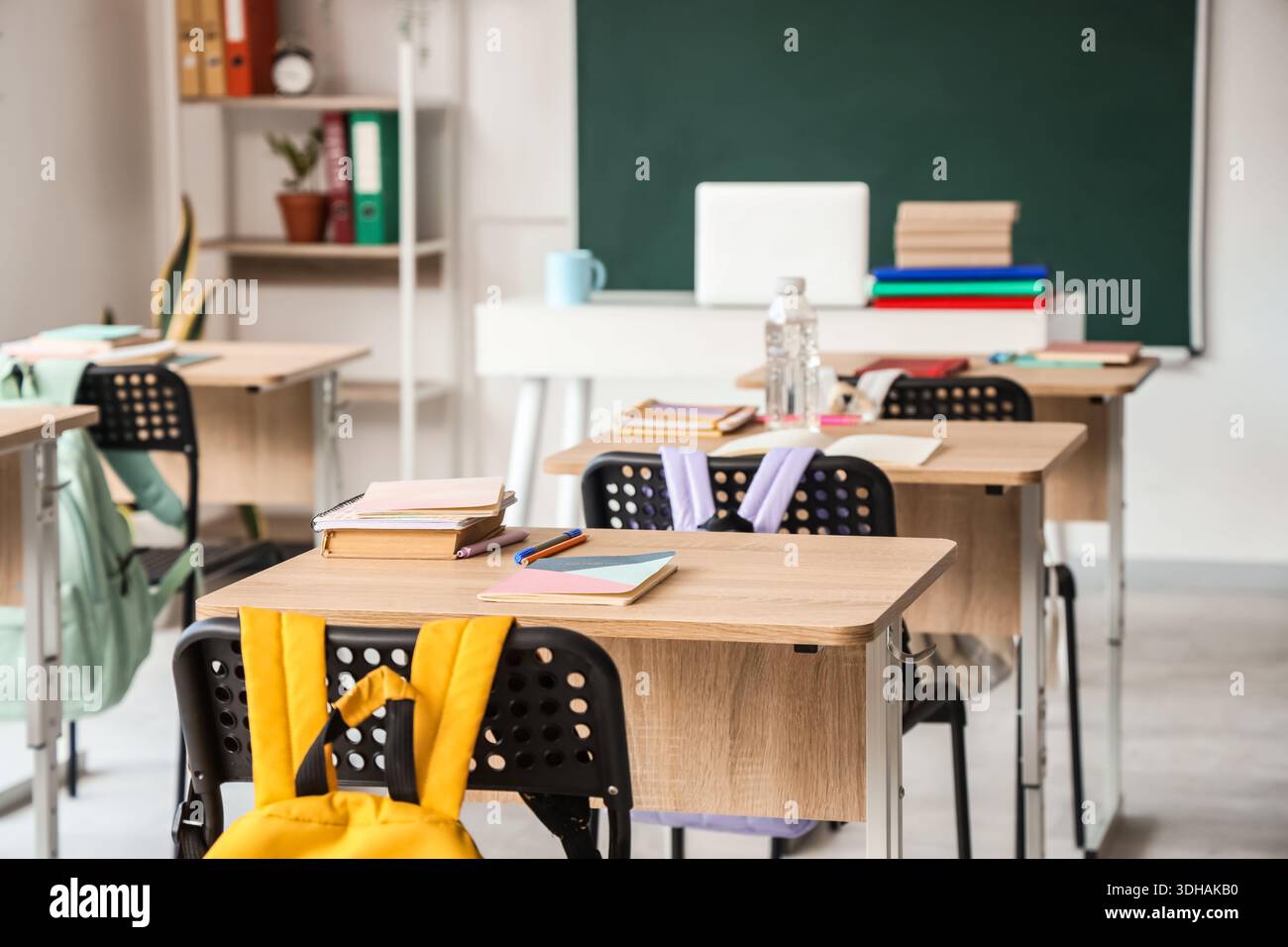 School desks stationery backpacks hi-res stock photography and images ...