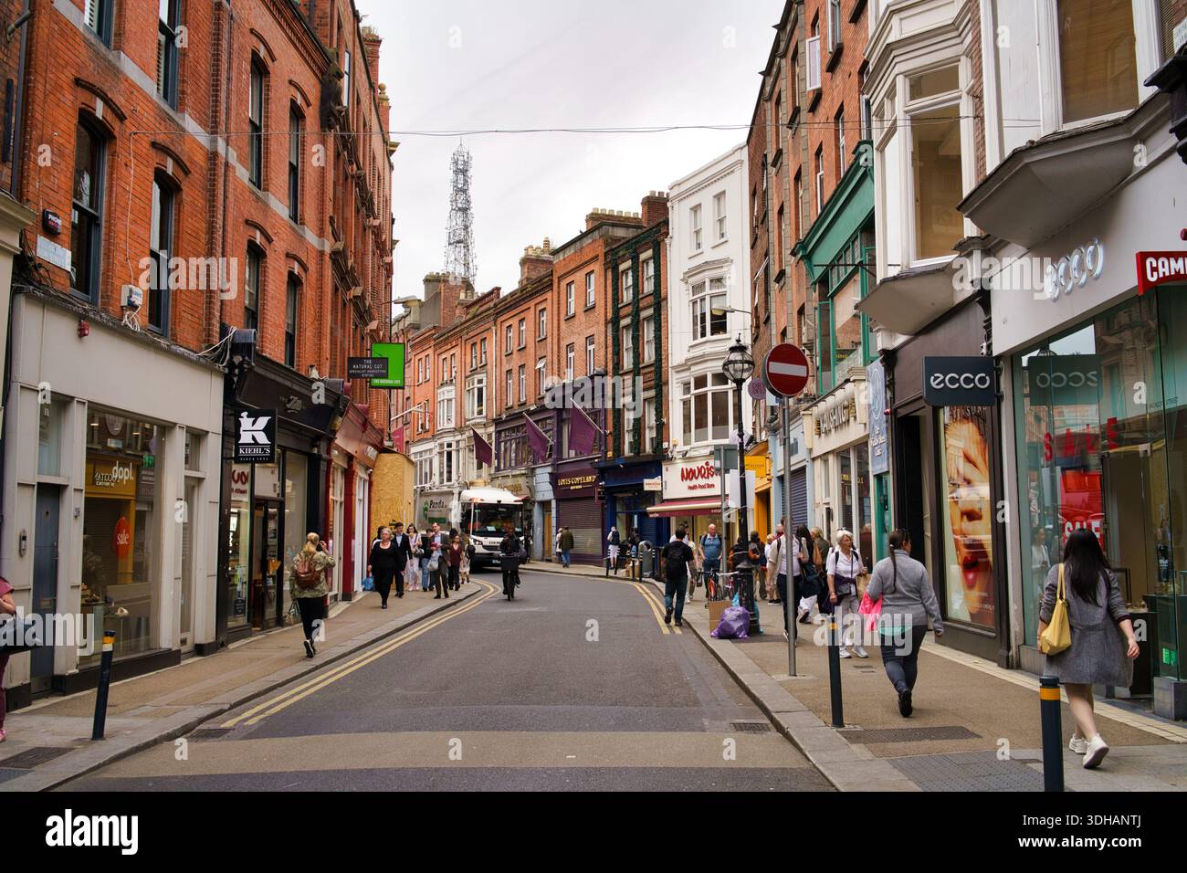 A bustling street scene in Dublin, Ireland, showcasing historic ...