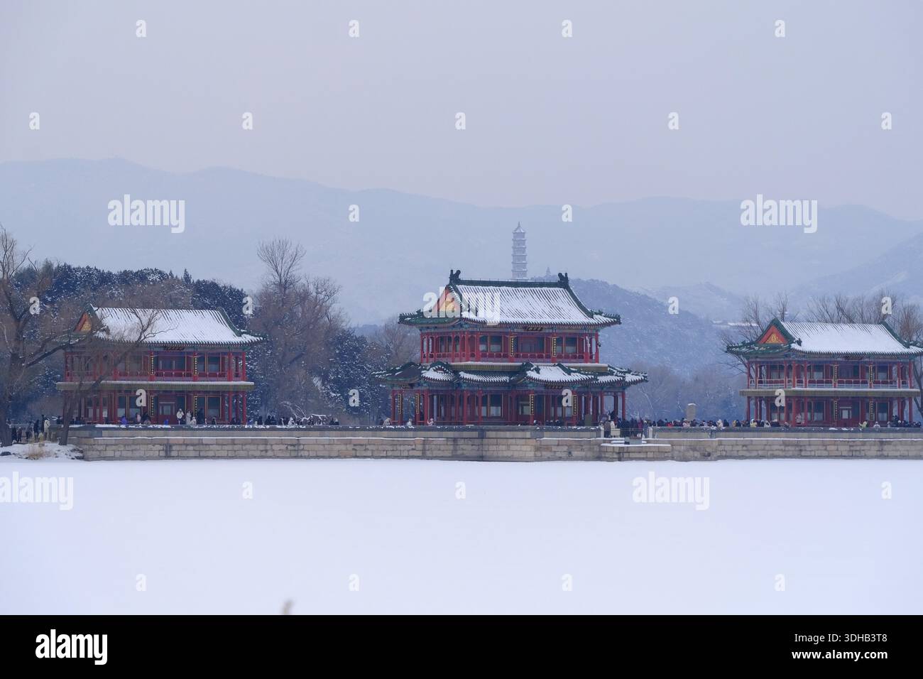 Workers clear snow from Kunming Lake after Beijing's first snowfall in ...