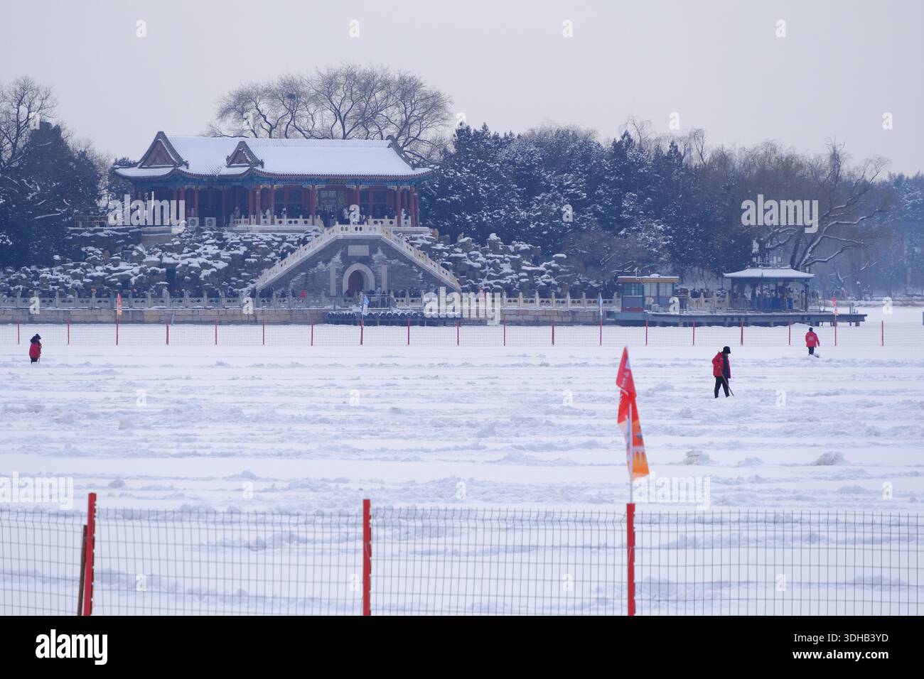 Workers clear snow from Kunming Lake after Beijing's first snowfall in ...