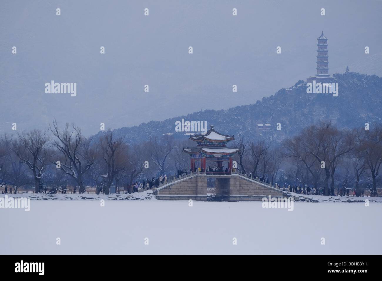Workers clear snow from Kunming Lake after Beijing's first snowfall in ...