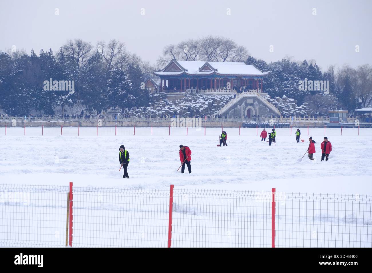 Workers clear snow from Kunming Lake after Beijing's first snowfall in ...