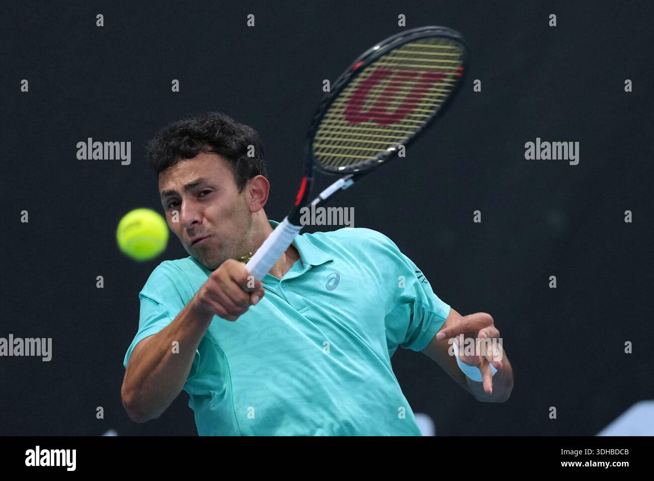 Emilio Nava of the U.S. plays a forehand return to Cameron Norrie of ...
