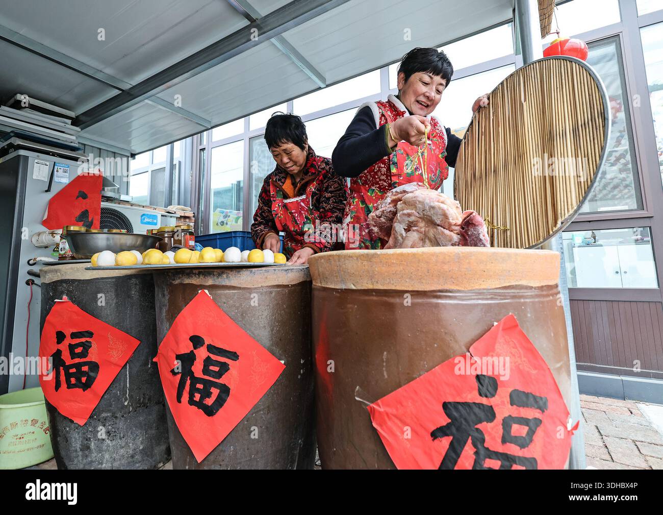 Huludao, China's Liaoning Province. 14th Jan, 2026. Villagers prepare ...