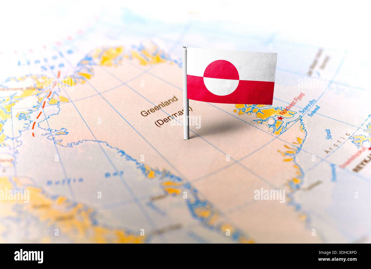 Greenland national flag pin on a geographic map showing Greenland and ...