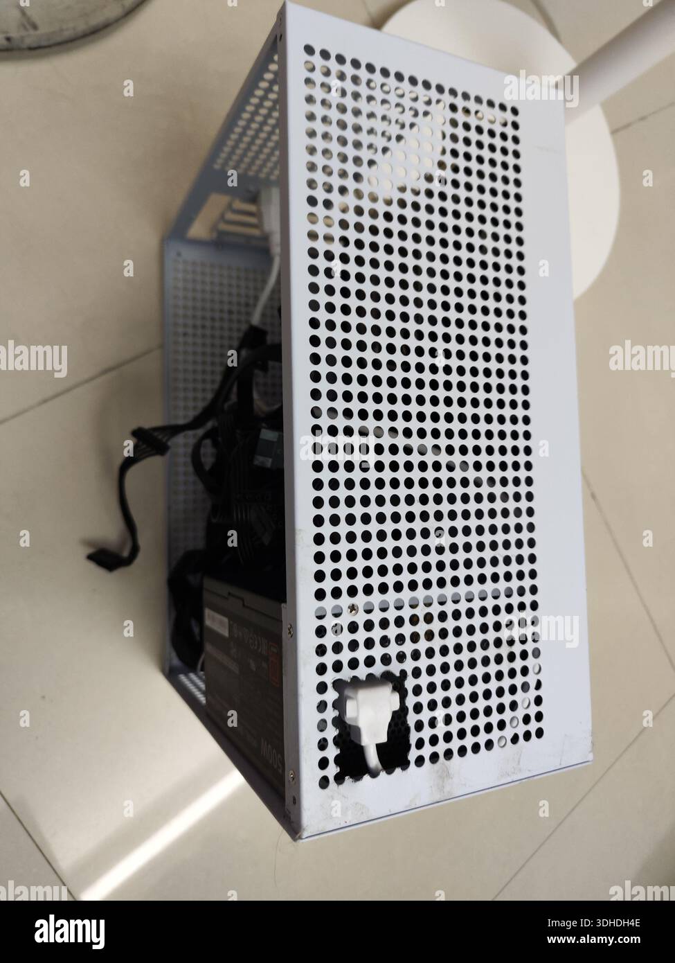 Top-down view of a computer case with perforated side panel and ...
