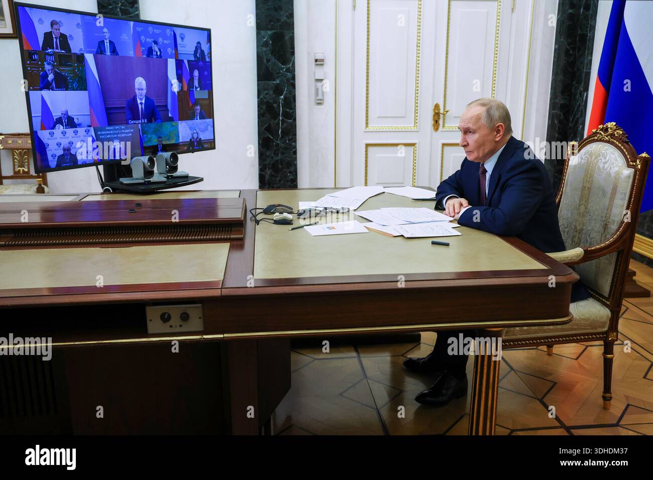 Russian President Vladimir Putin attends a cabinet meeting via ...