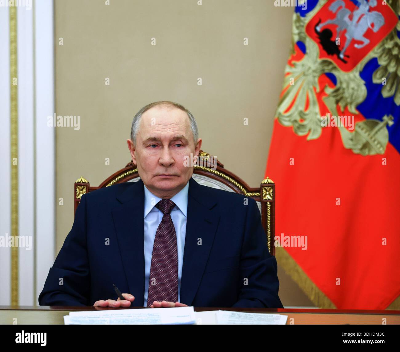 Russian President Vladimir Putin attends a cabinet meeting via ...