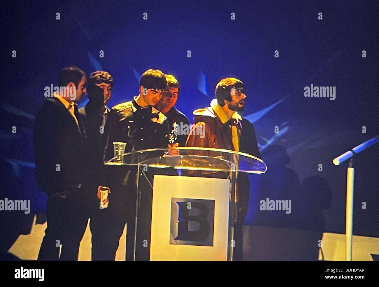 Oasis accepts a multitude of awards at the Brits in 1996. The music ...