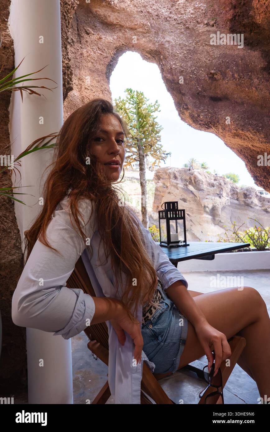 Woman in cave terrace hi-res stock photography and images - Alamy