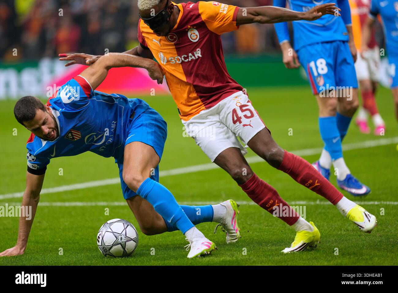 Atletico Madrid's David Hancko, left, vies for the ball with ...