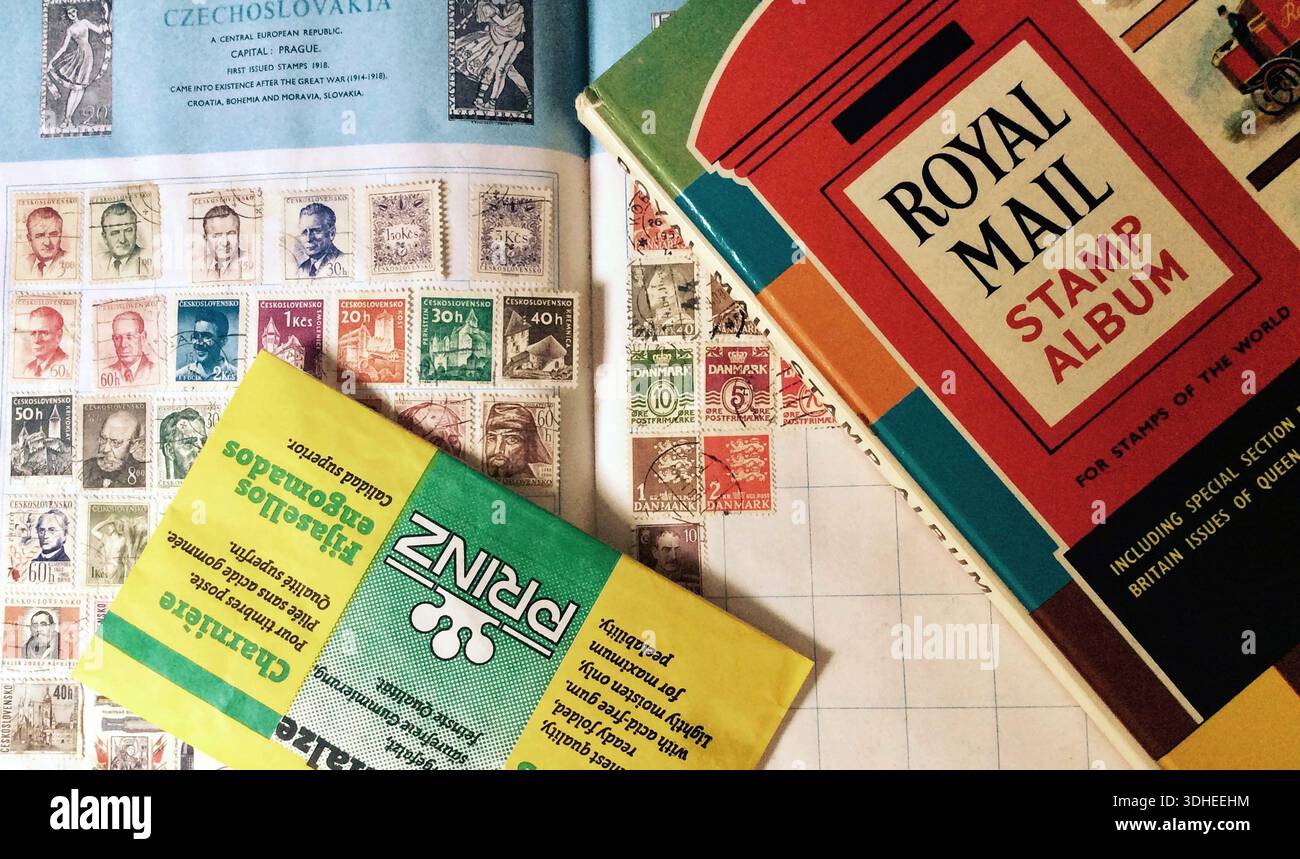 How to stick stamps into albums hi-res stock photography and images - Alamy