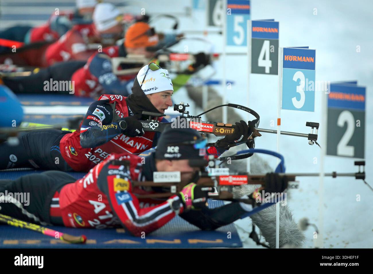 Eric Perrot of France, left, attends men's training prior to the ...