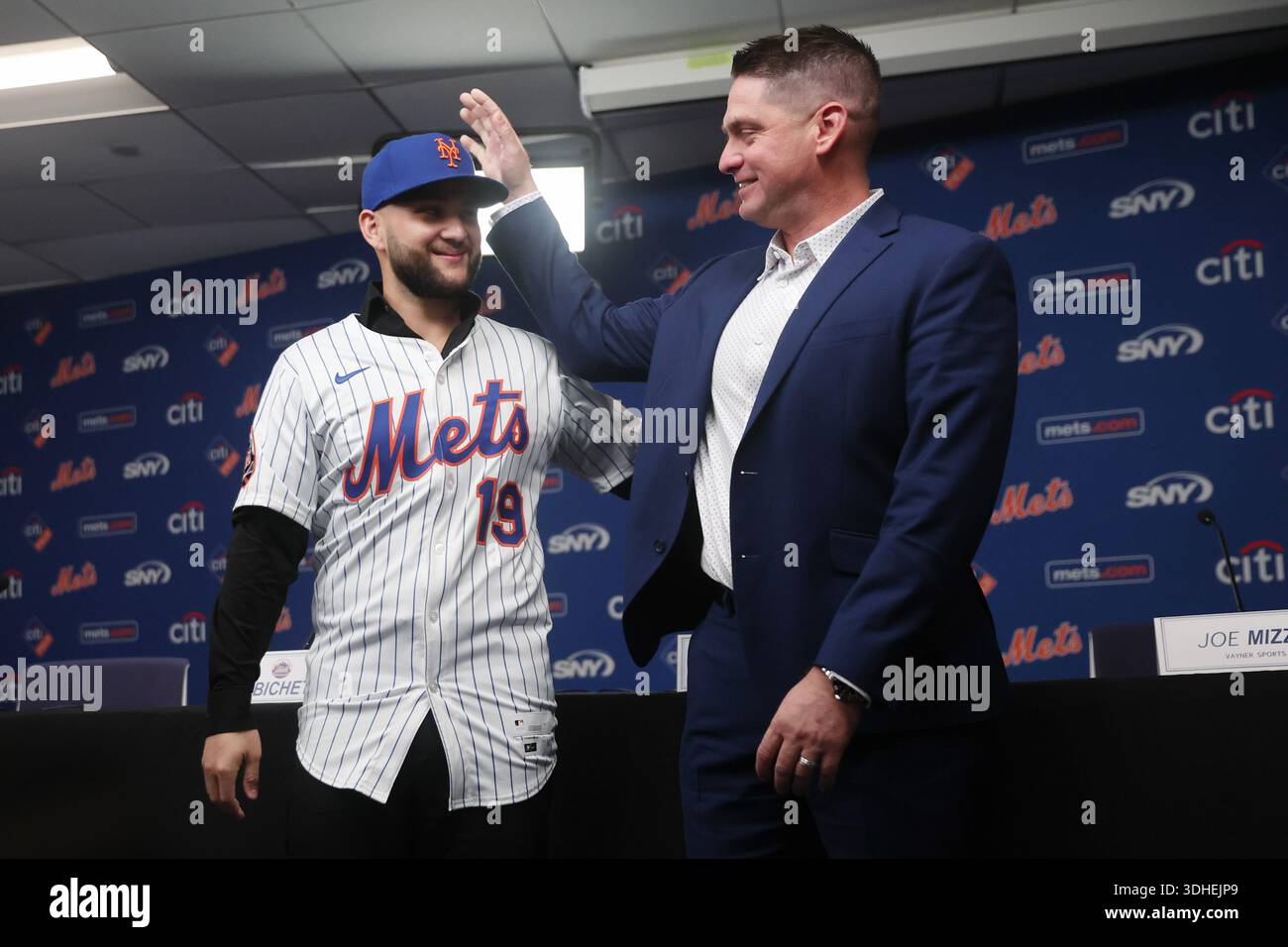 Bo Bichette, left, poses for a photo with New York Mets manager Carlos ...
