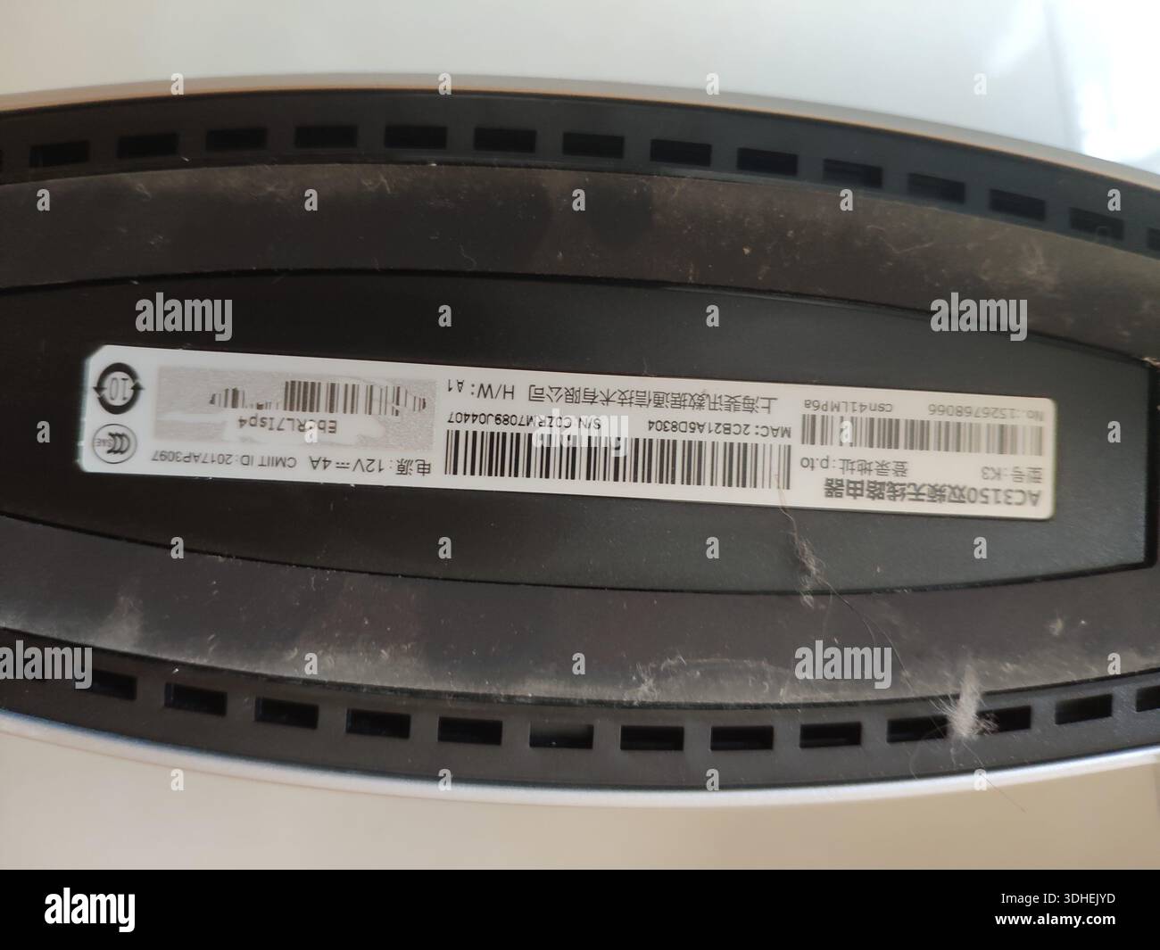 Close-up of a wireless router label with barcodes and technical ...