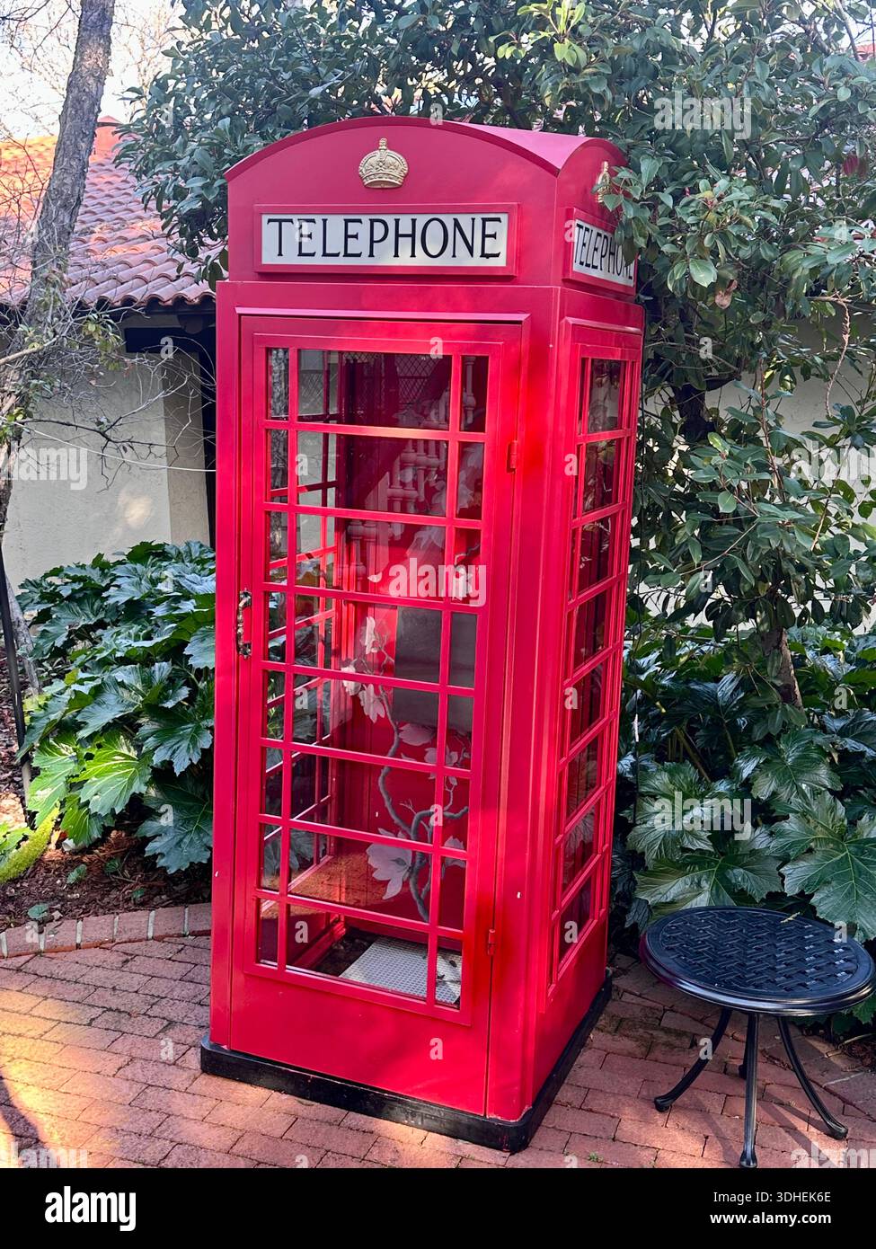 Iconic Red British Telephone Booth in Garden Setting Stock Photo - Alamy